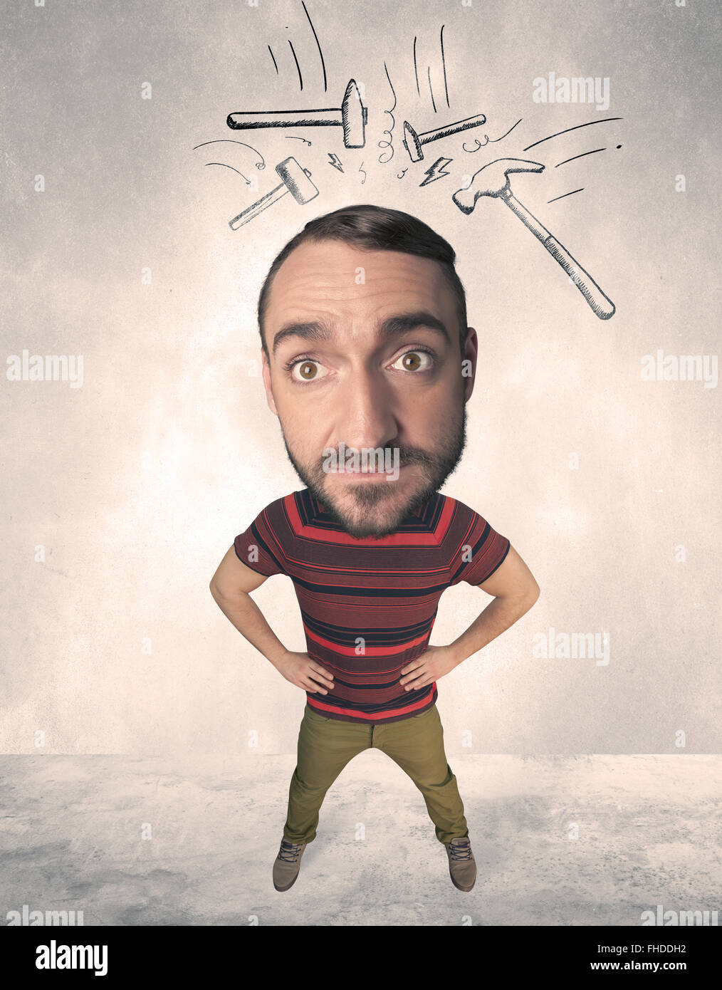 Big head person with drawn hammers Stock Photo - Alamy