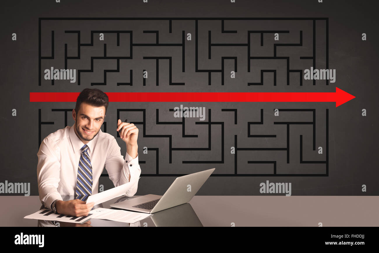 businessman with a solved puzzle in background Stock Photo - Alamy