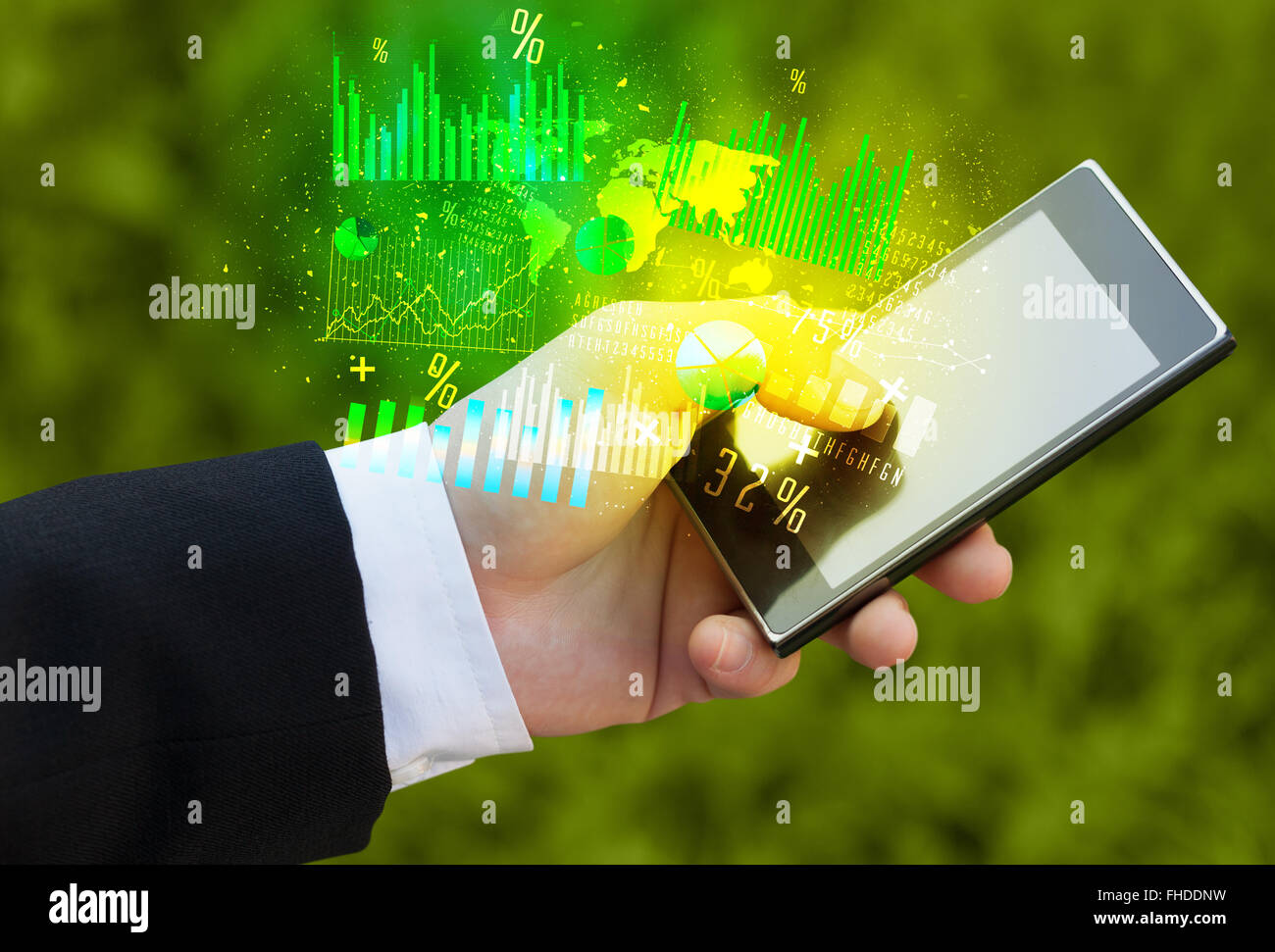 Hand holding smartphone with business diagrams Stock Photo - Alamy