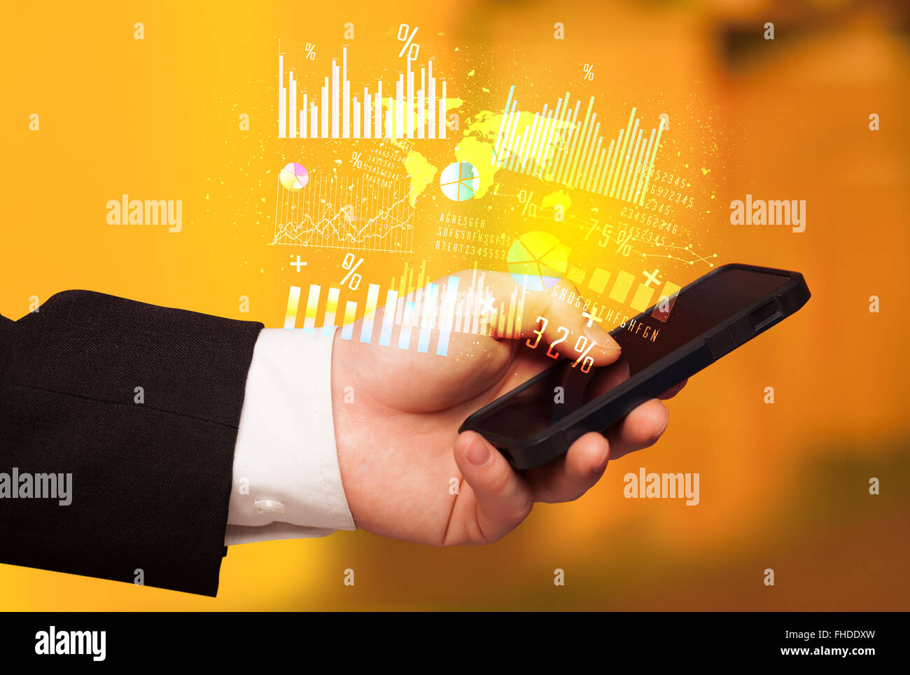 Hand holding smartphone with business diagrams Stock Photo - Alamy