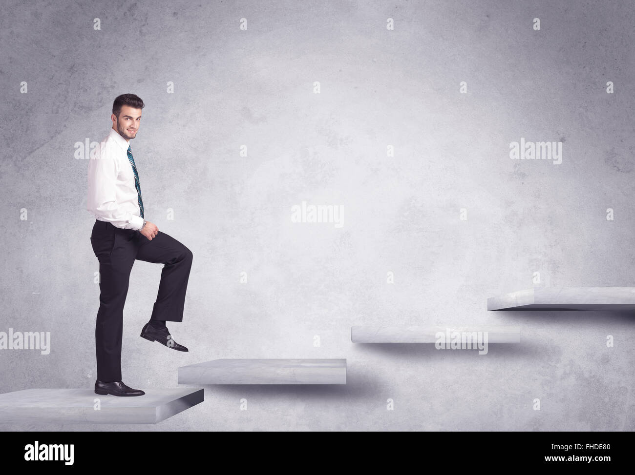 Stepping up a staircase Stock Photo - Alamy