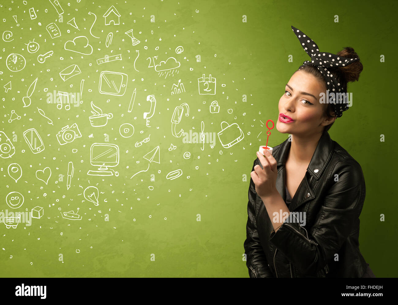 Cute girl blowing hand drawn media icons and symbols Stock Photo - Alamy
