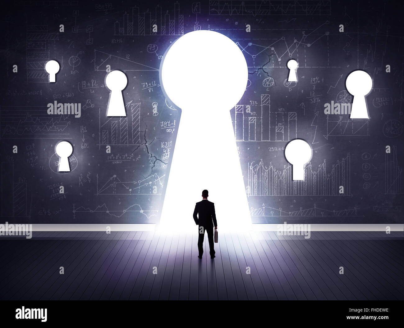 businessman looking through keyhole Stock Photo - Alamy
