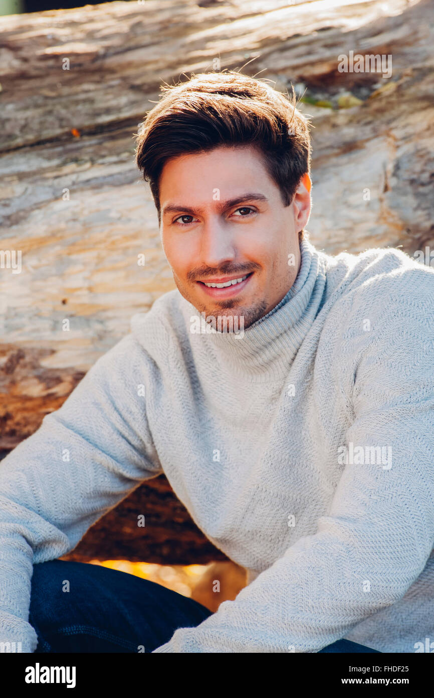 Portrait of smiling young man outdoors Stock Photo - Alamy