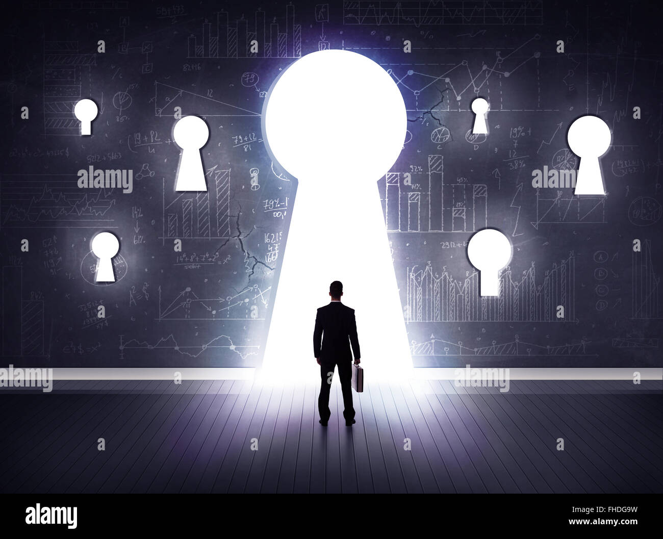 businessman looking through keyhole Stock Photo - Alamy