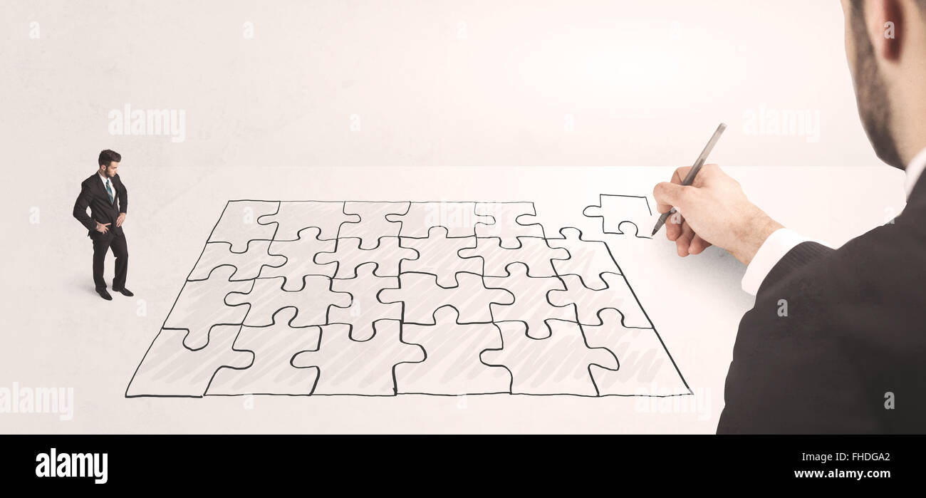 Business man looking at hand drawing solution Stock Photo - Alamy