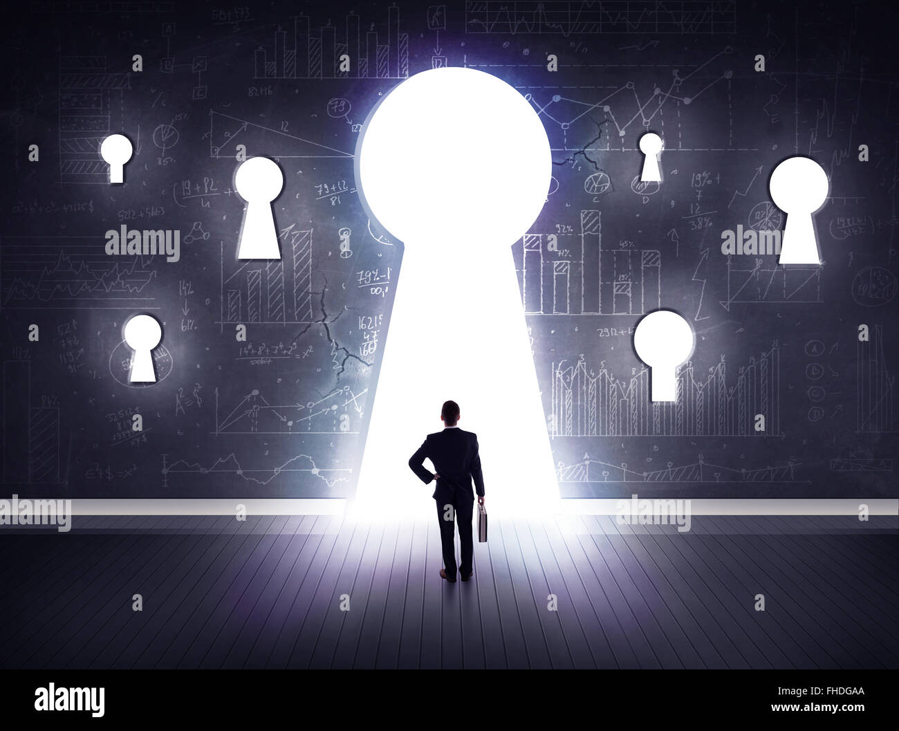 businessman looking through keyhole Stock Photo - Alamy