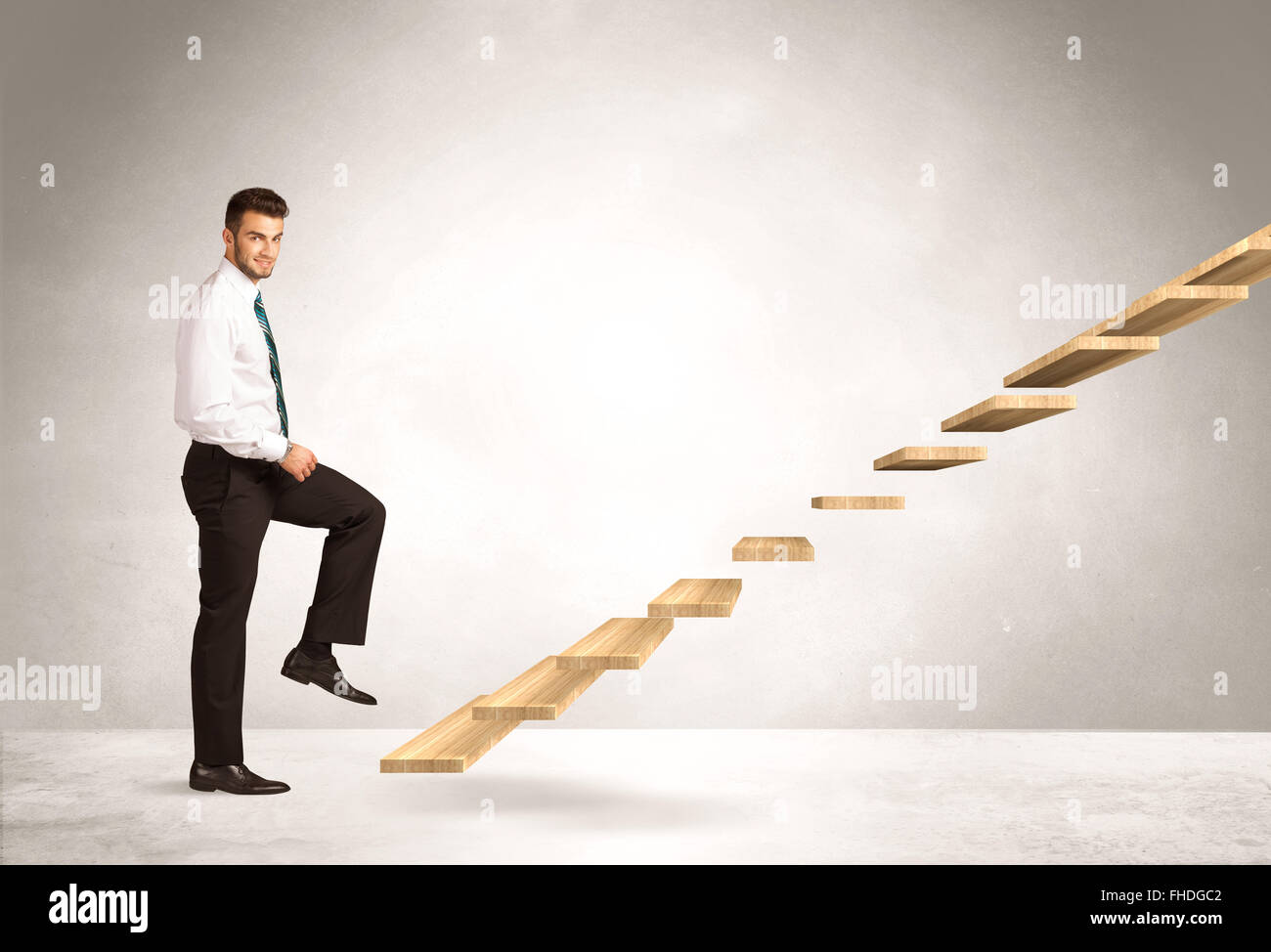 Stepping up a staircase Stock Photo - Alamy