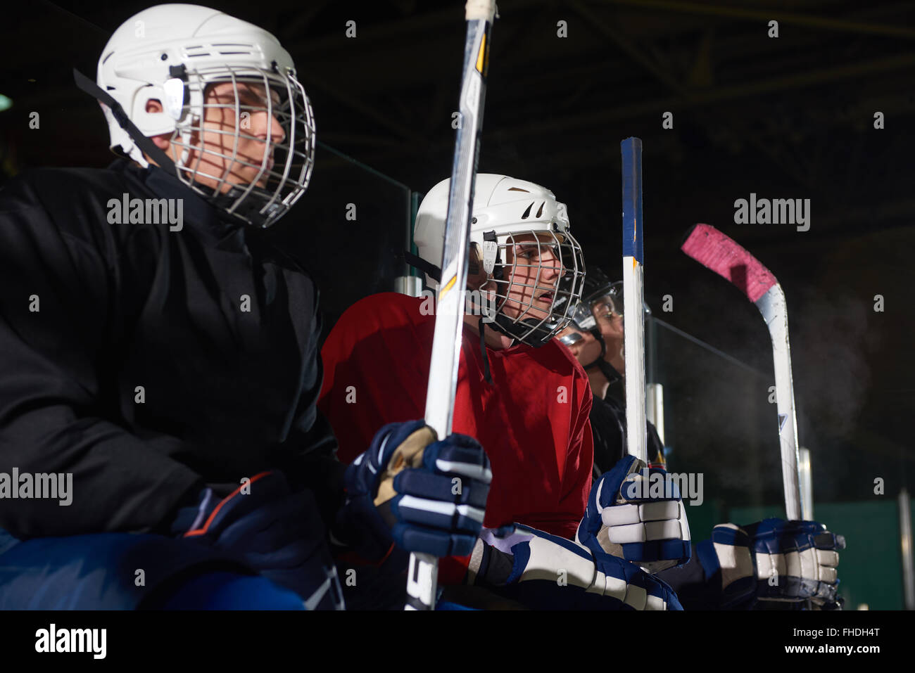 ice hockey players on bench Stock Photo - Alamy