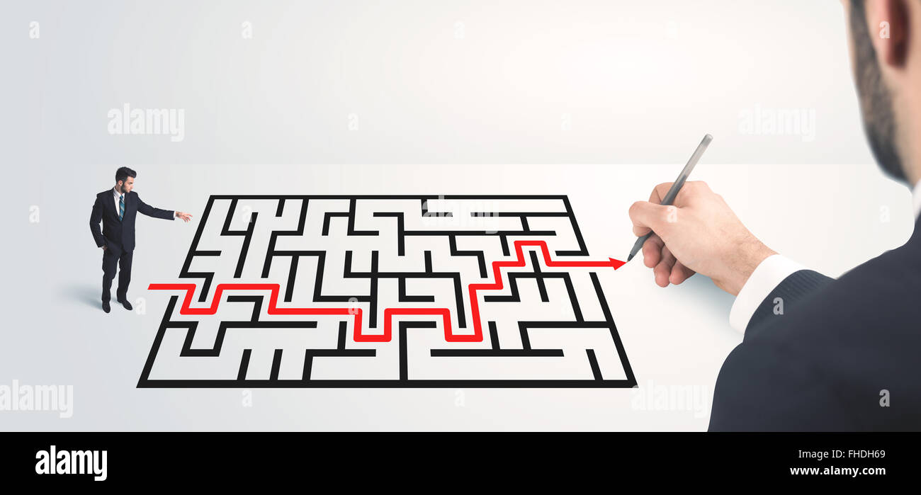 Business man looking at hand drawing solution Stock Photo - Alamy