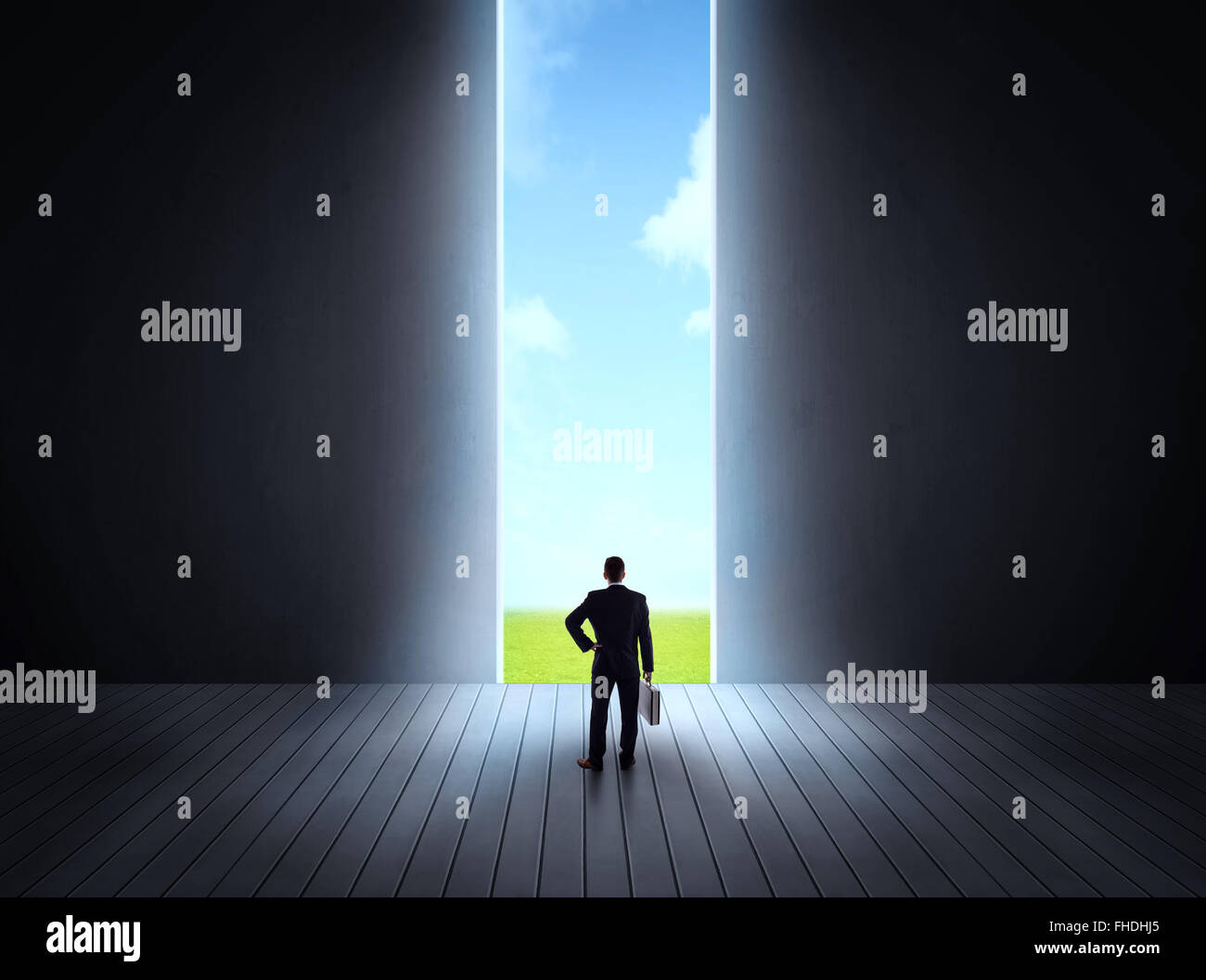 businessman walking to open gate Stock Photo - Alamy
