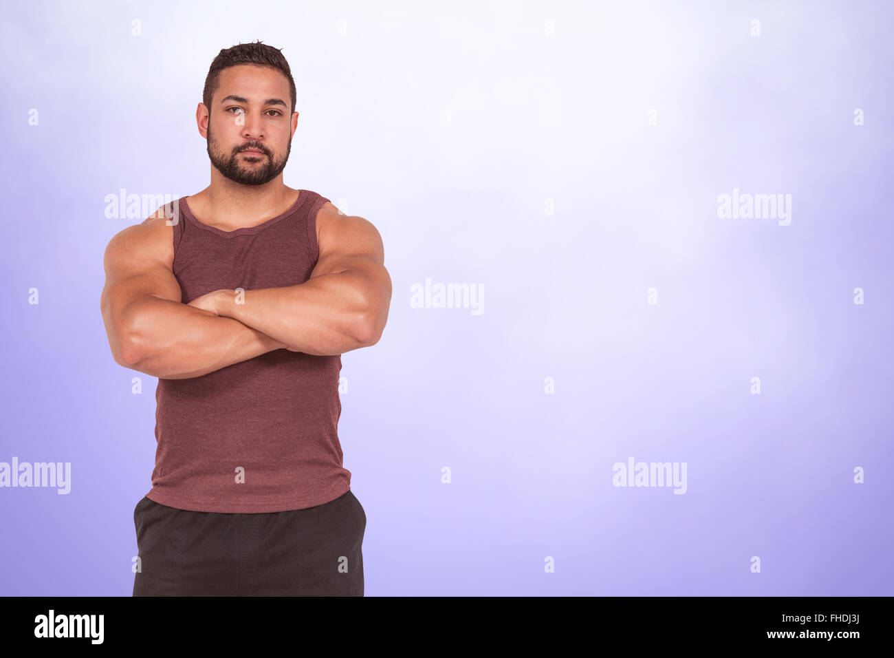 Serious muscular man arms folded hi-res stock photography and images ...
