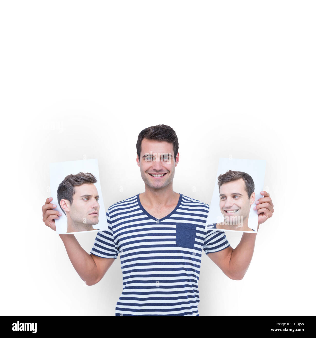Man holding photos of his face Stock Photo - Alamy