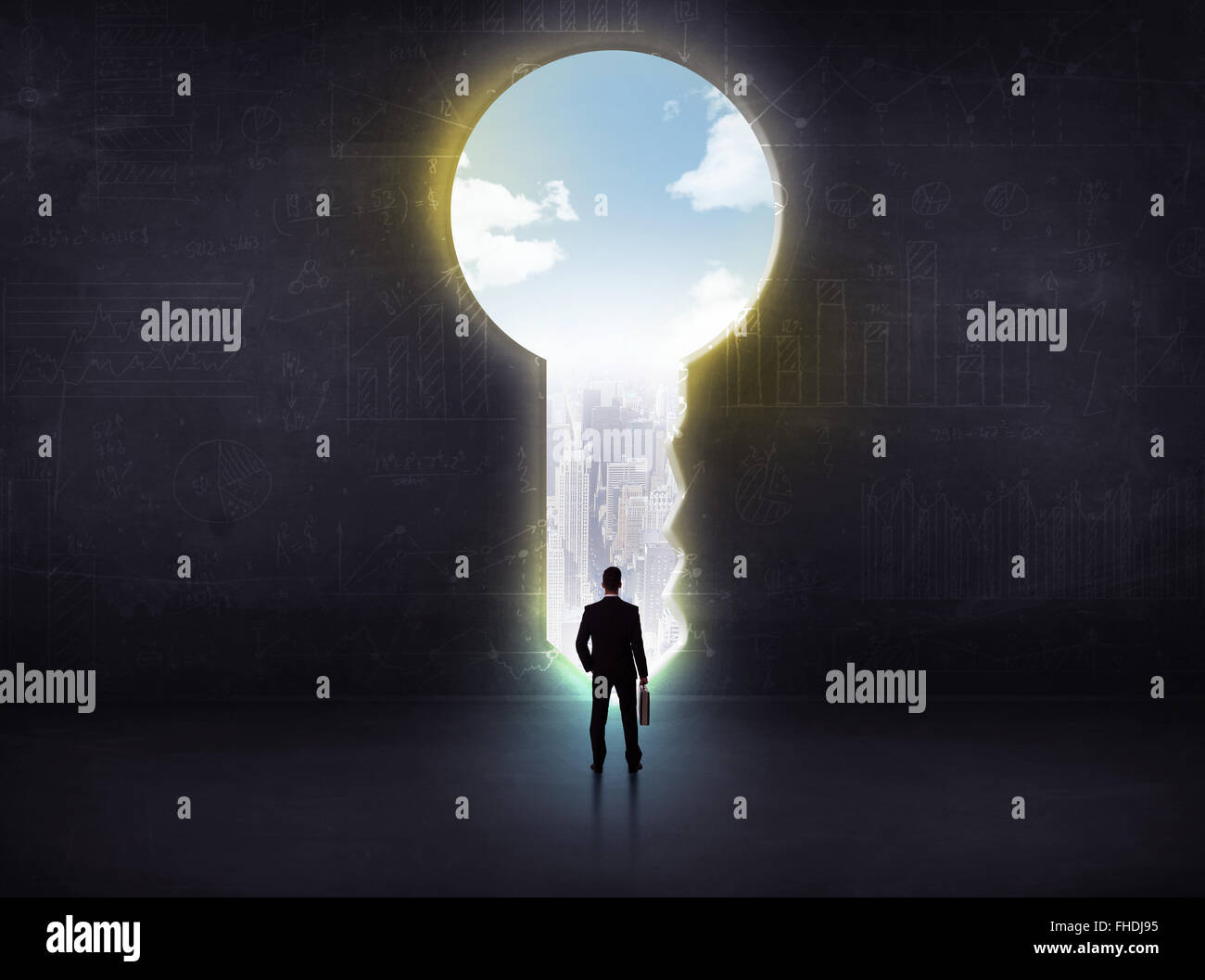 businessman looking a big key Stock Photo - Alamy