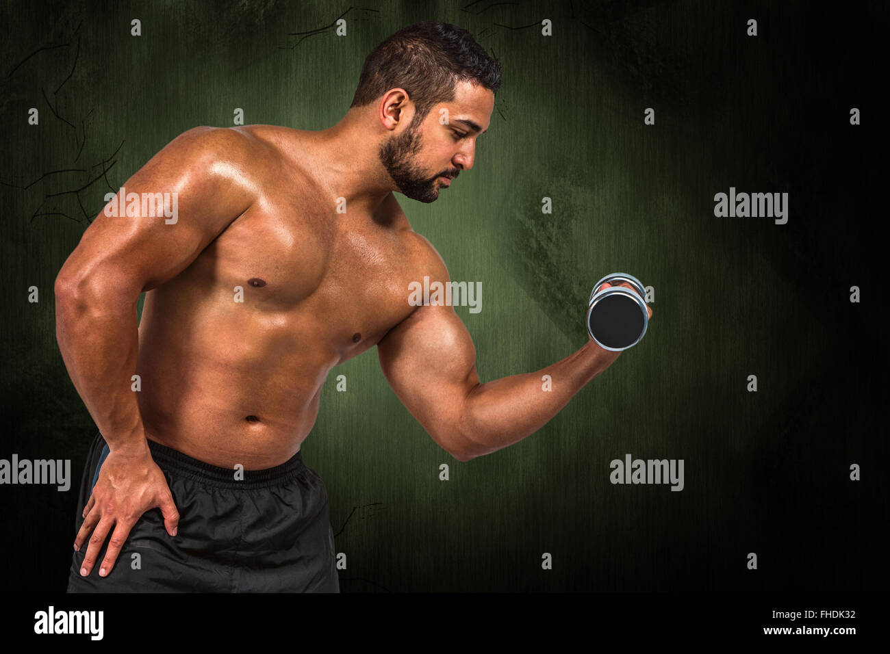 Composite image of muscular man lifting heavy dumbbell Stock Photo - Alamy