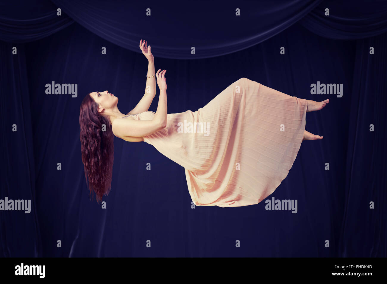Composite image of full length of woman flying Stock Photo - Alamy