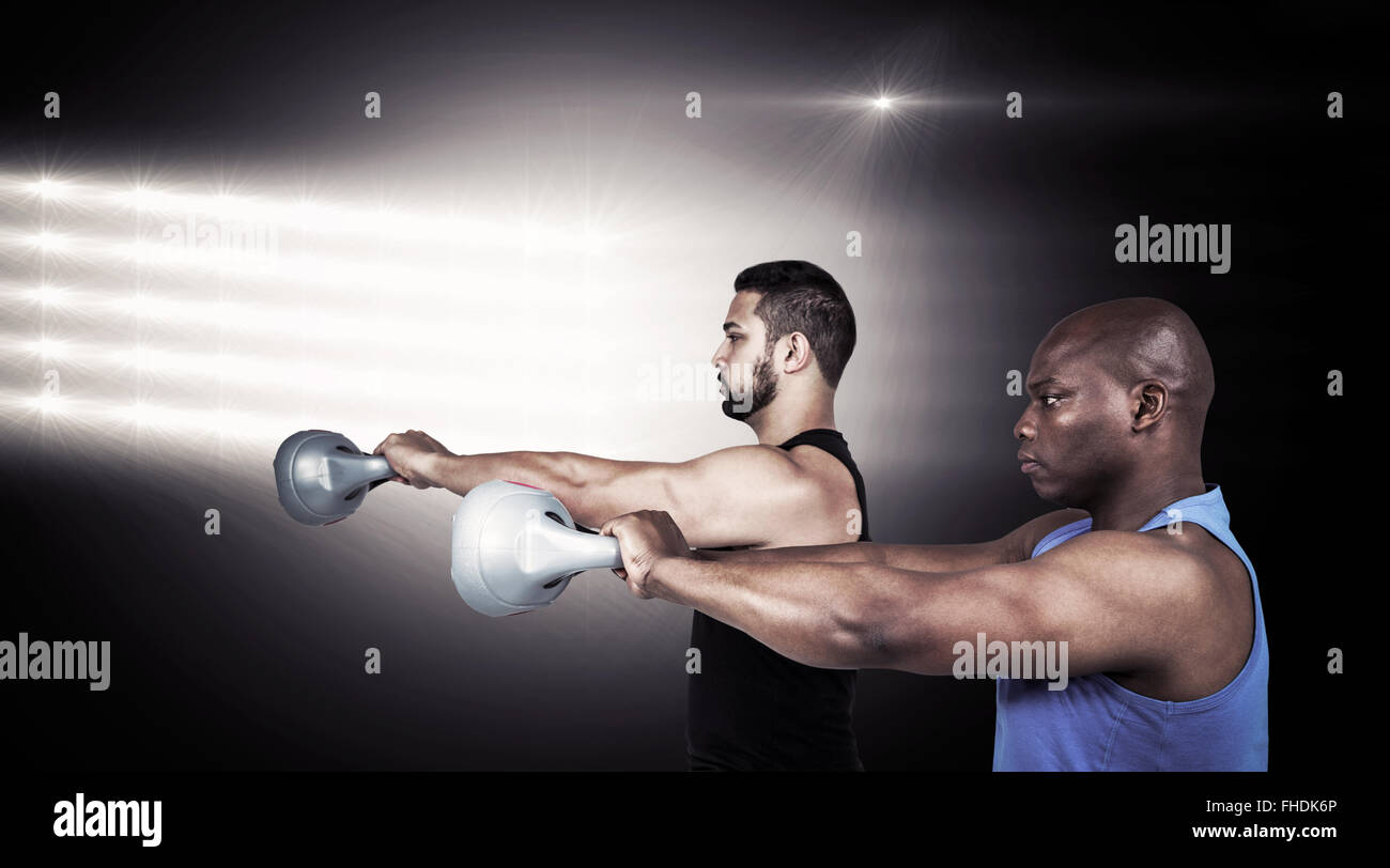 Composite image of strong friends lifting kettlebells together Stock ...