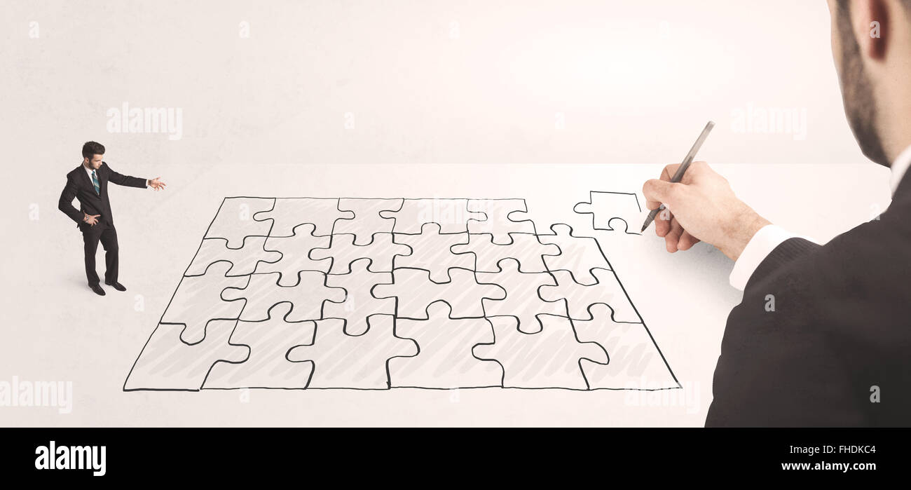 Business man looking at hand drawing solution Stock Photo - Alamy