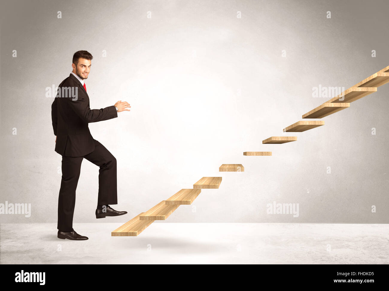 Stepping up a staircase Stock Photo - Alamy