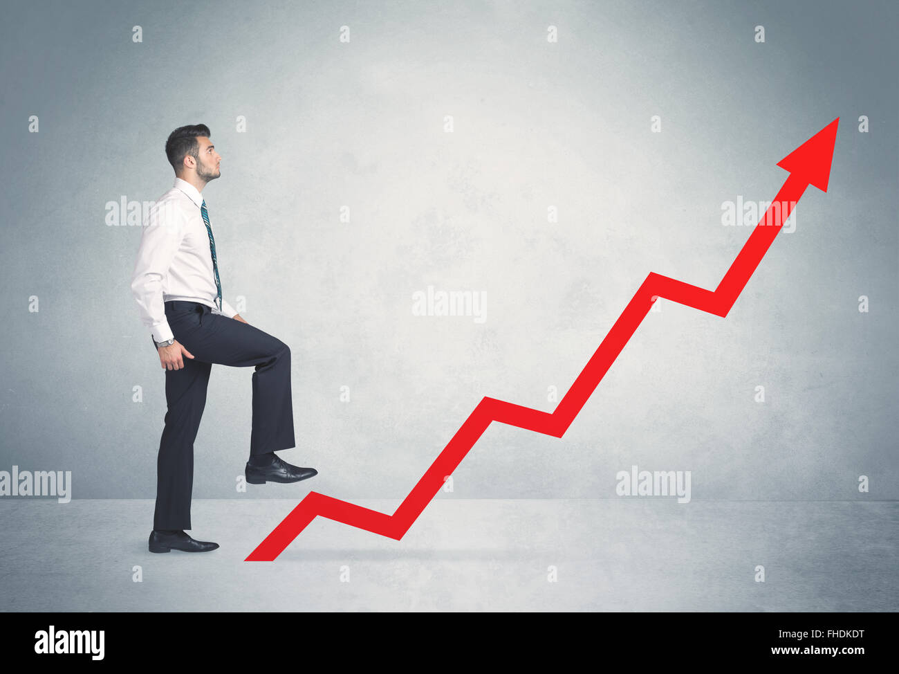 Climbing on red graph arrow Stock Photo - Alamy