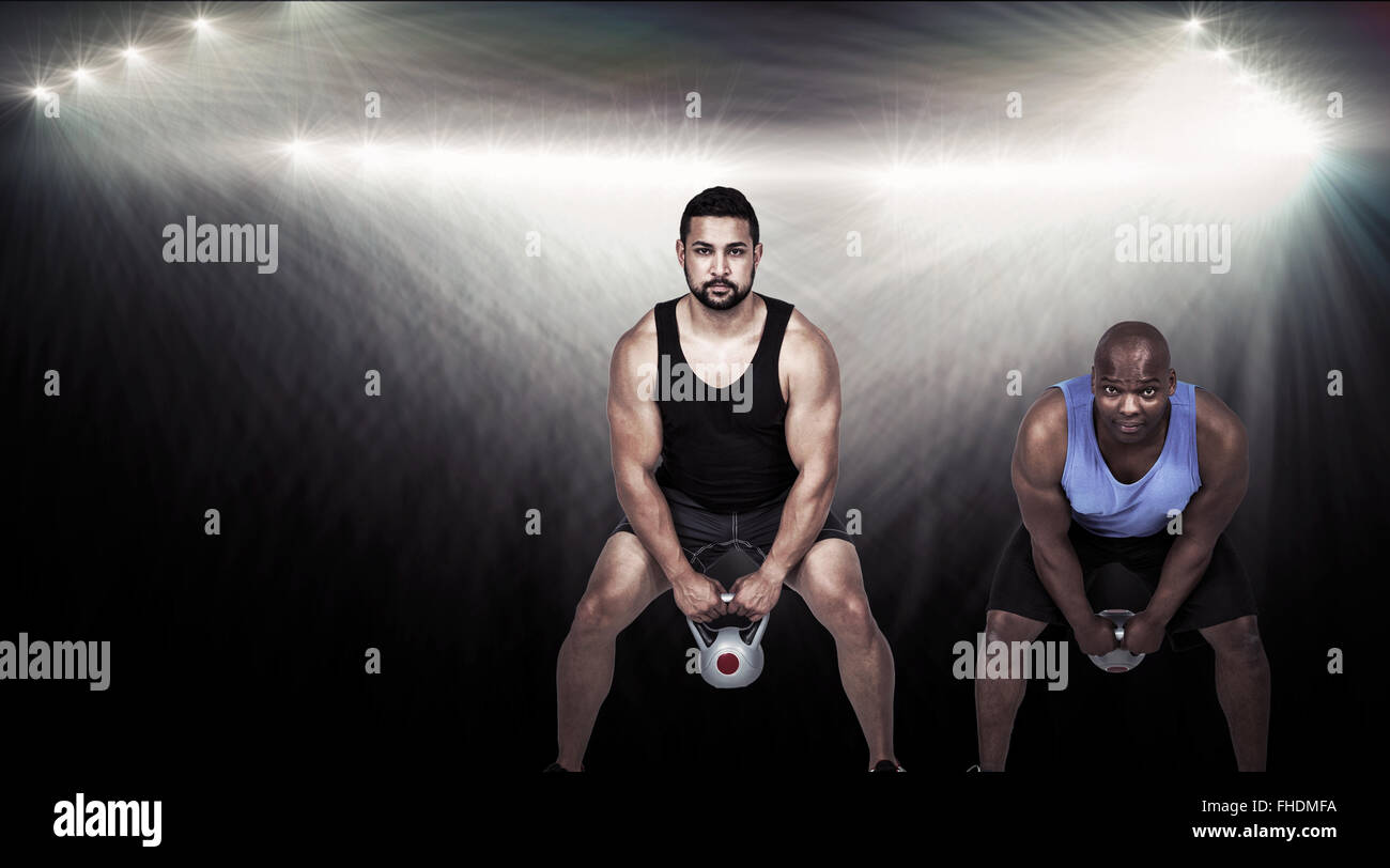 Composite image of strong friends lifting kettlebells together Stock ...