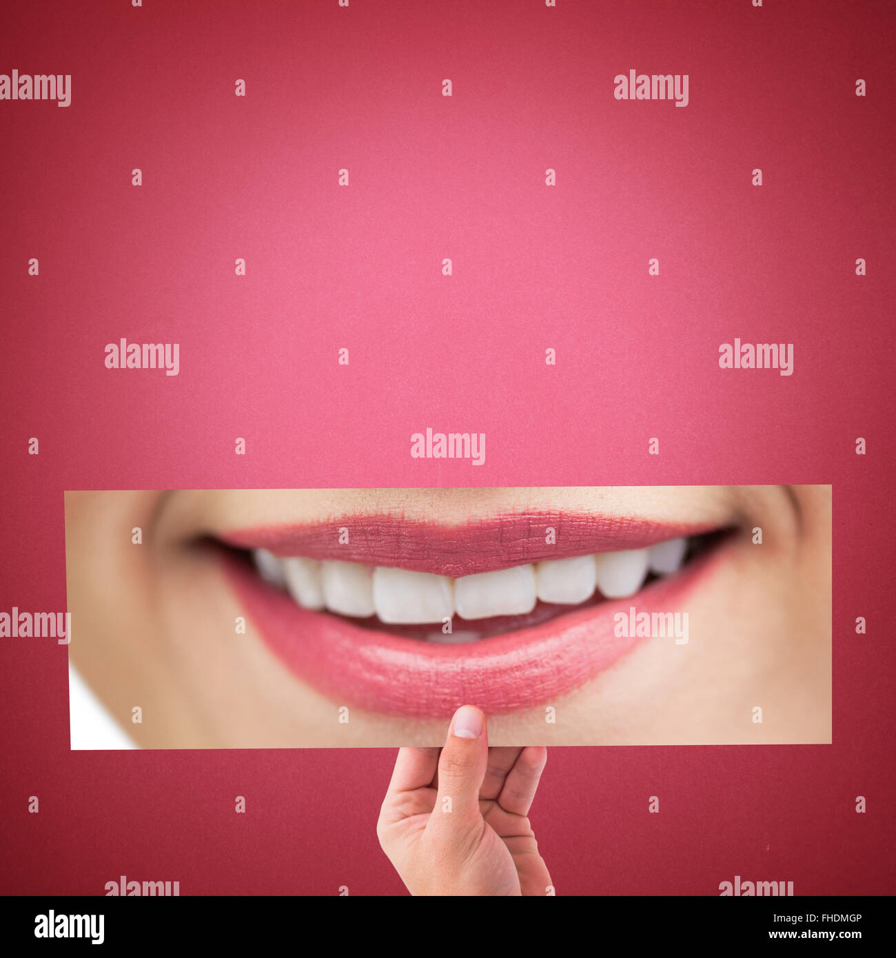 Composite image of hands showing photo of smile Stock Photo - Alamy