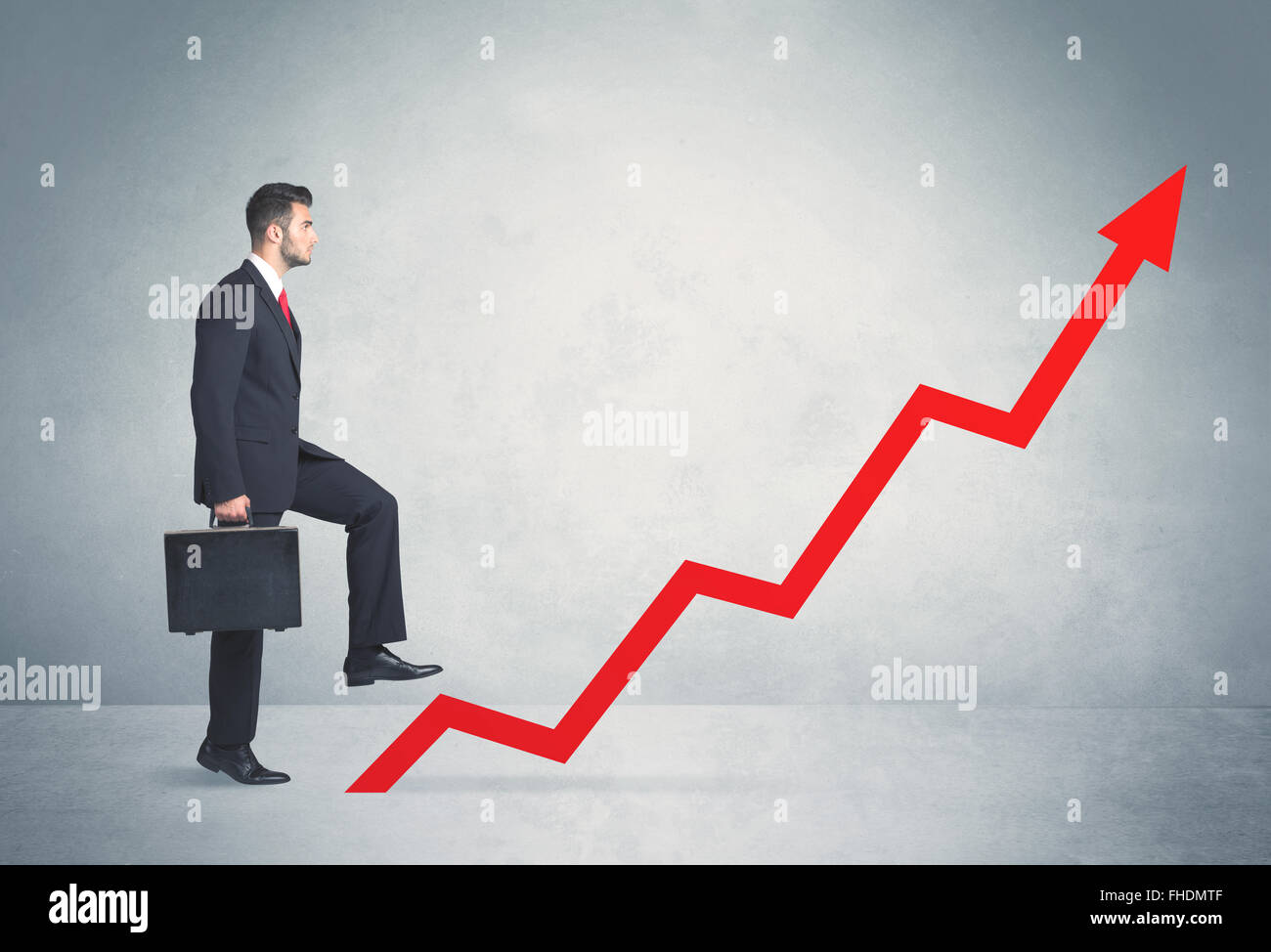 Climbing on red graph arrow Stock Photo - Alamy