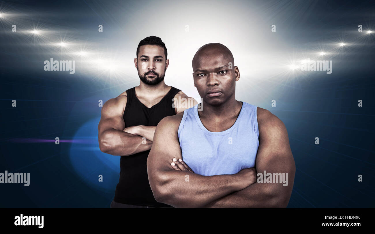 Composite image of strong friends looking at camera Stock Photo - Alamy