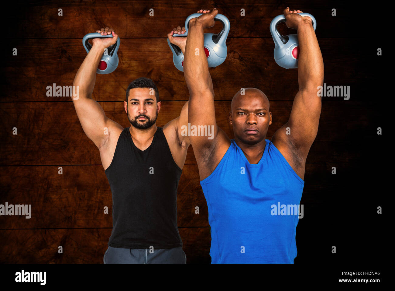 Composite image of strong friends lifting kettlebells together Stock ...
