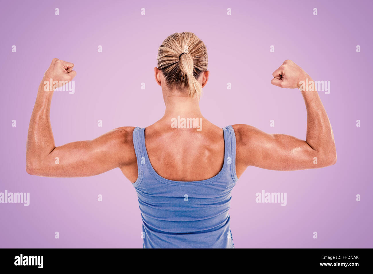 Rear view athletic woman flexing hi-res stock photography and images ...