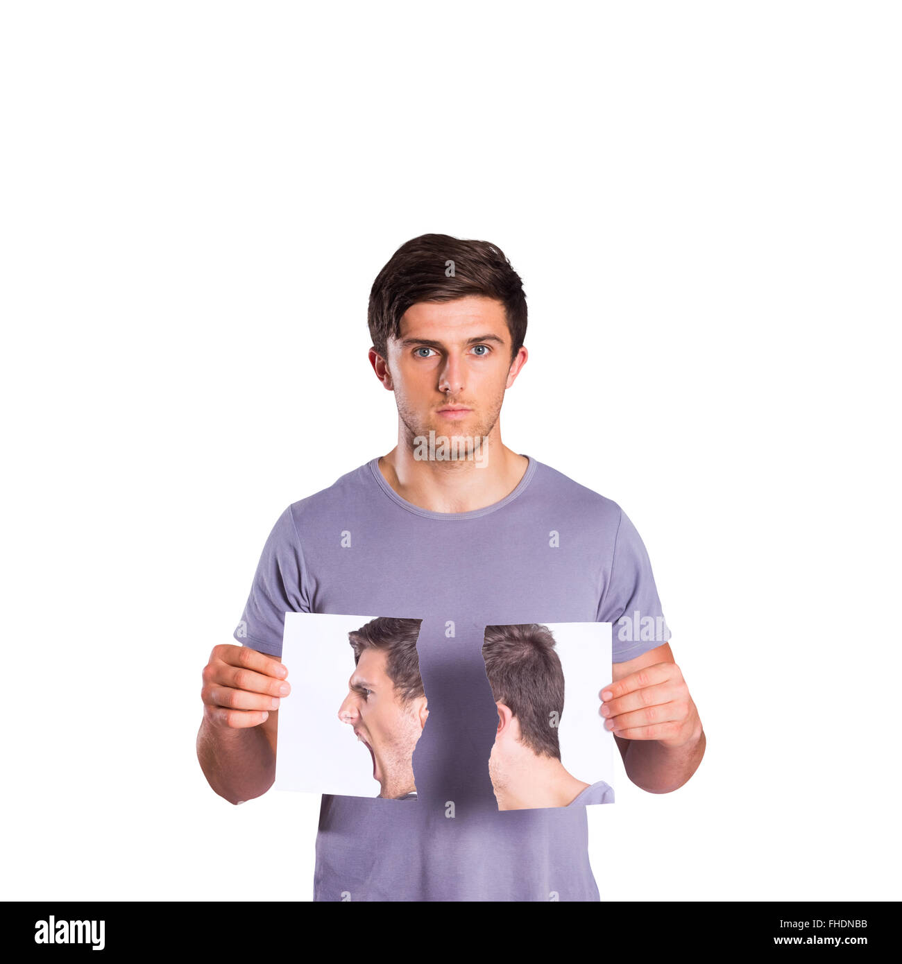 Man ripping photo of himself Stock Photo - Alamy