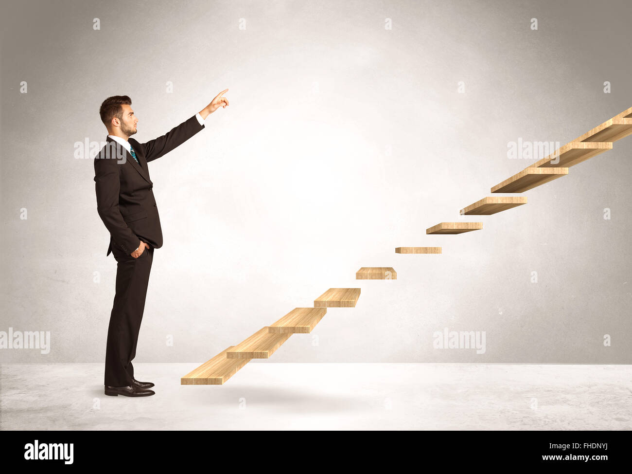 Stepping up a staircase Stock Photo - Alamy