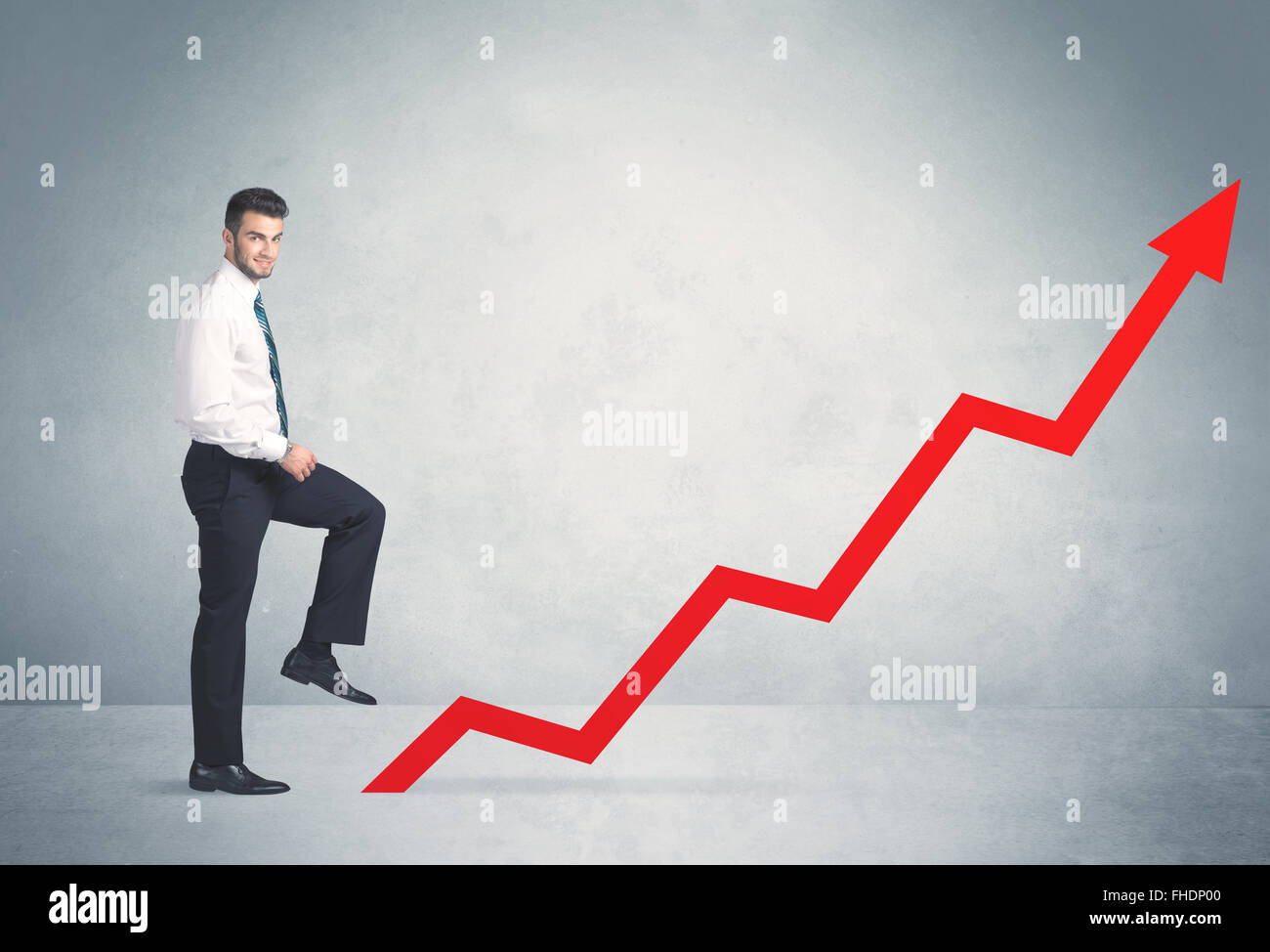 Climbing on red graph arrow Stock Photo - Alamy