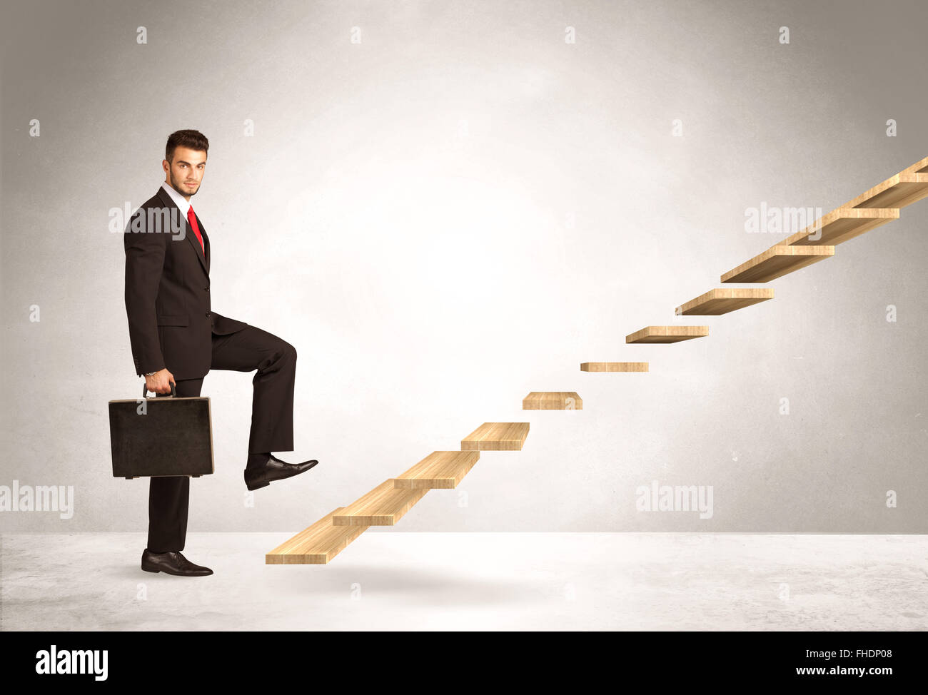 Stepping up a staircase Stock Photo - Alamy
