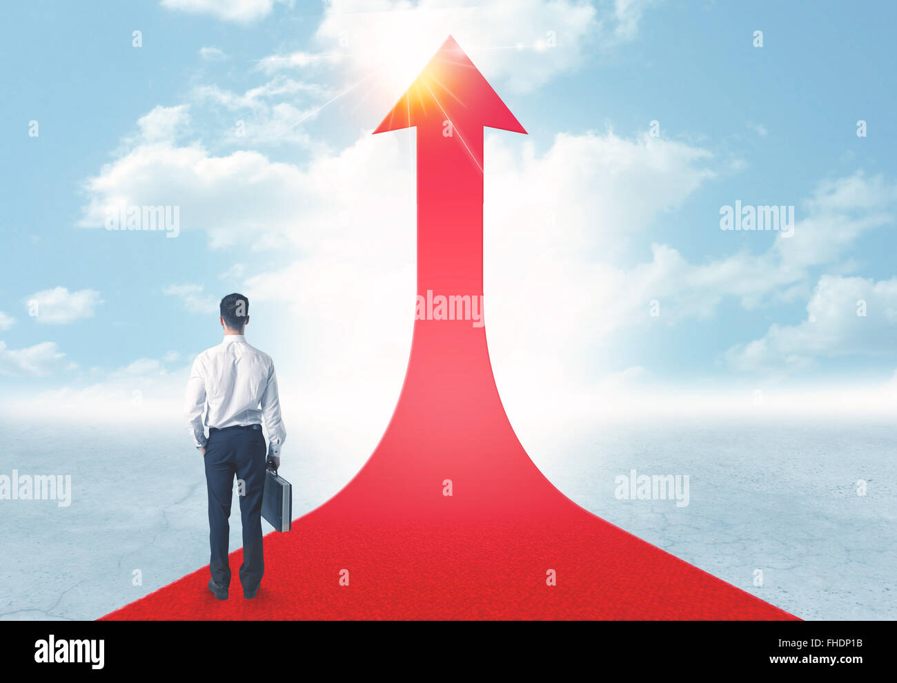 businessman standing on a red arrow Stock Photo - Alamy