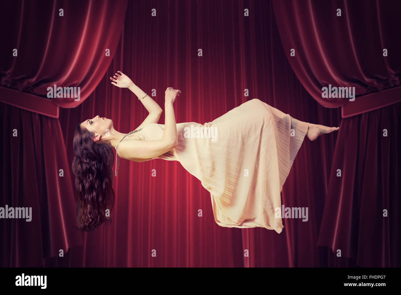 Composite image of full length of beautiful woman flying Stock Photo ...