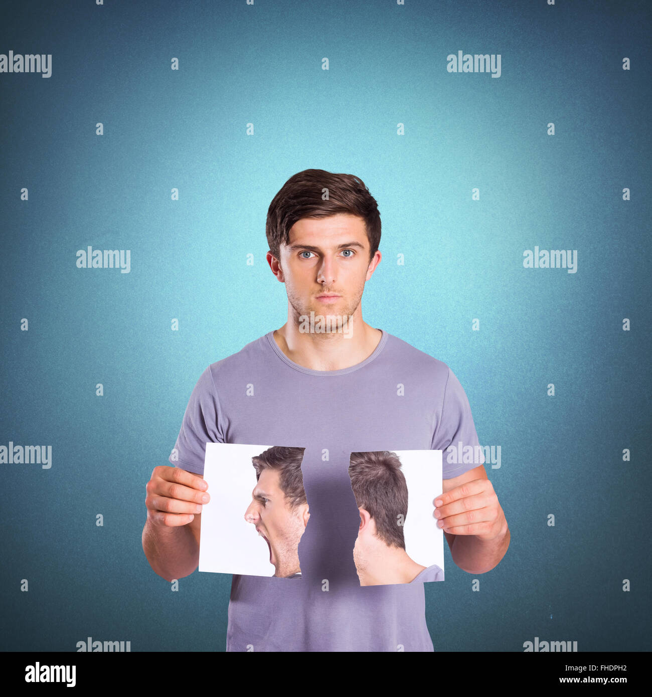 Composite image of man ripping photo of himself Stock Photo - Alamy