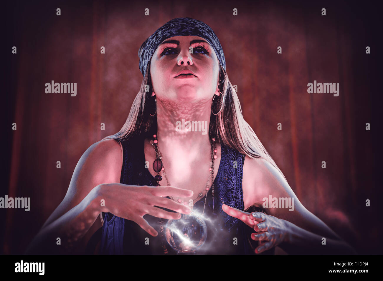 Composite image of fortune teller using crystal ball Stock Photo - Alamy