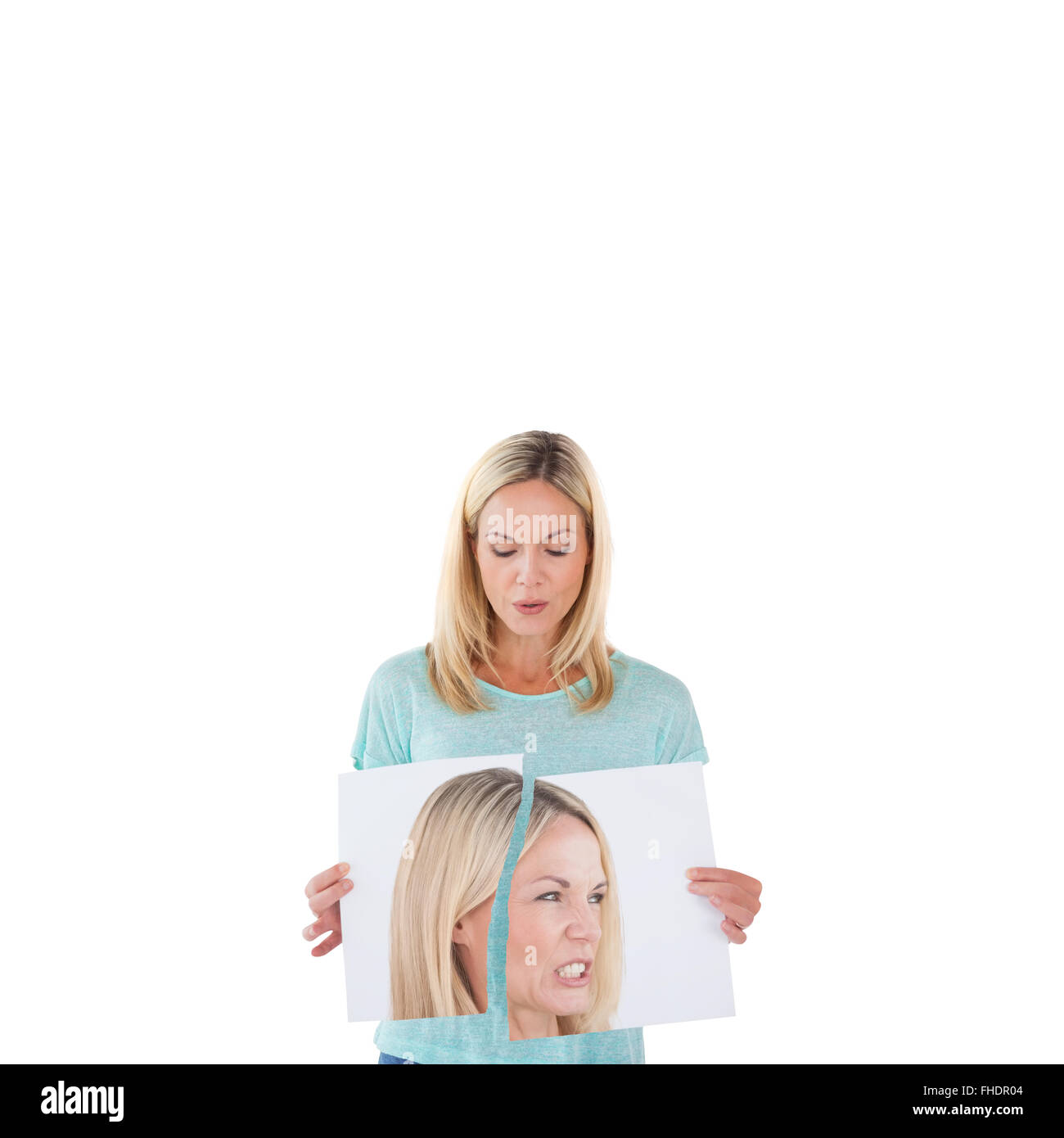 Woman ripping picture of herself Stock Photo - Alamy