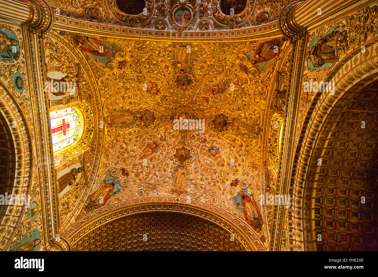The ornately painted and carved ceiling of the SANTA DOMINGO CHURCH a ...
