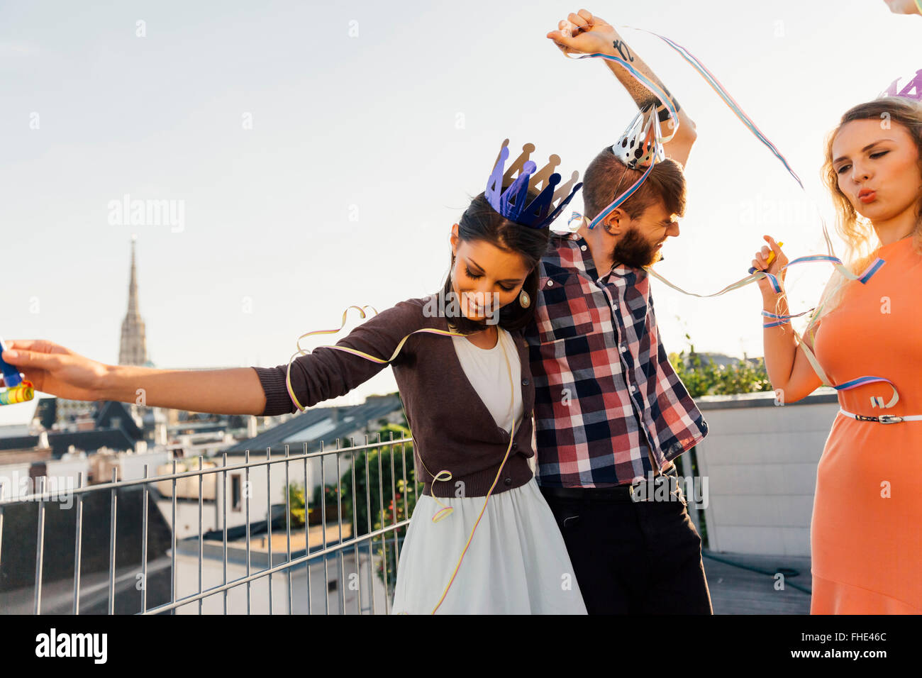 Austria, Vienna, Young people having a party on rooftop terrace Stock ...