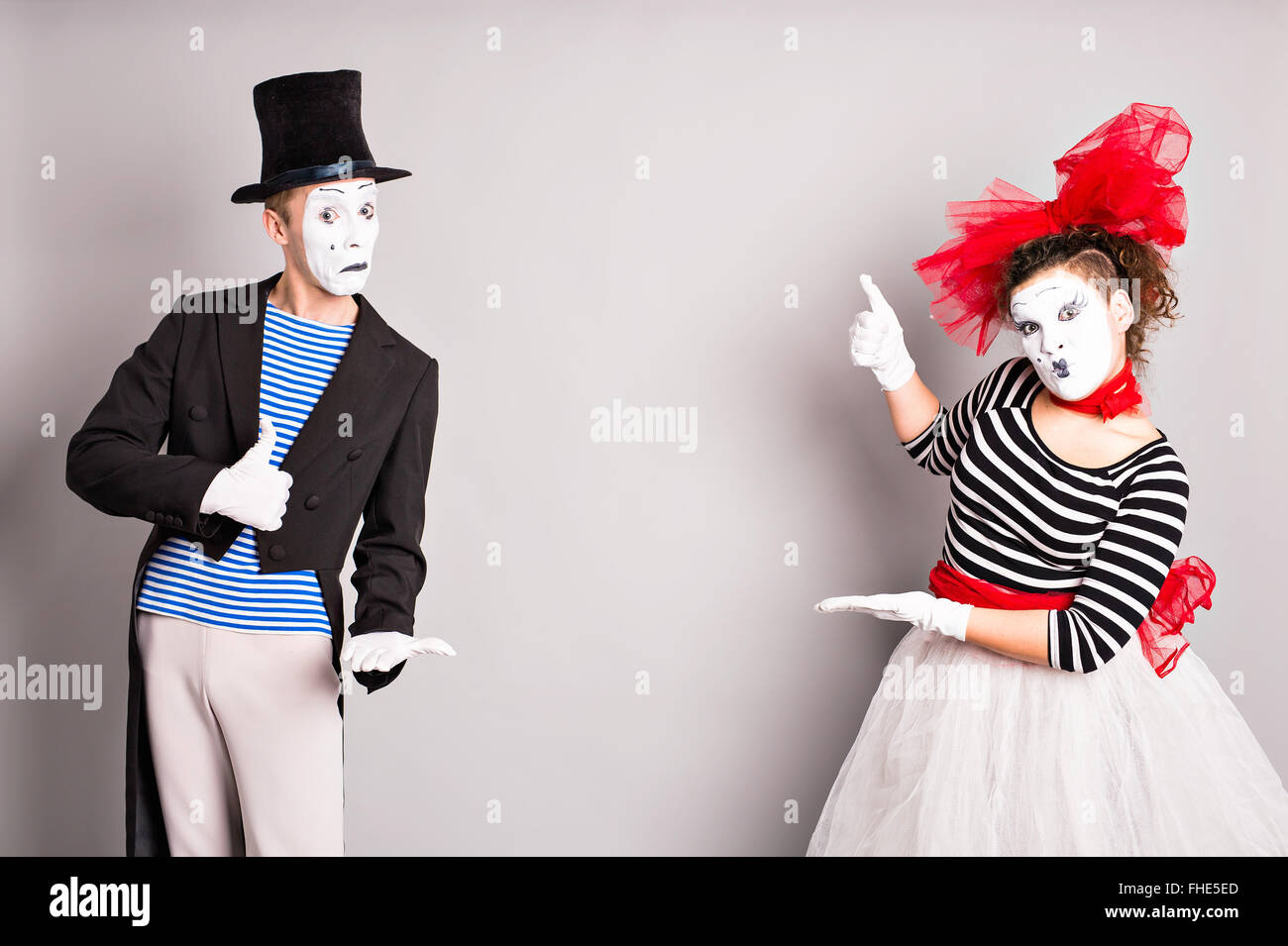 Your text here. Colorful studio portrait of mimes with gray background ...
