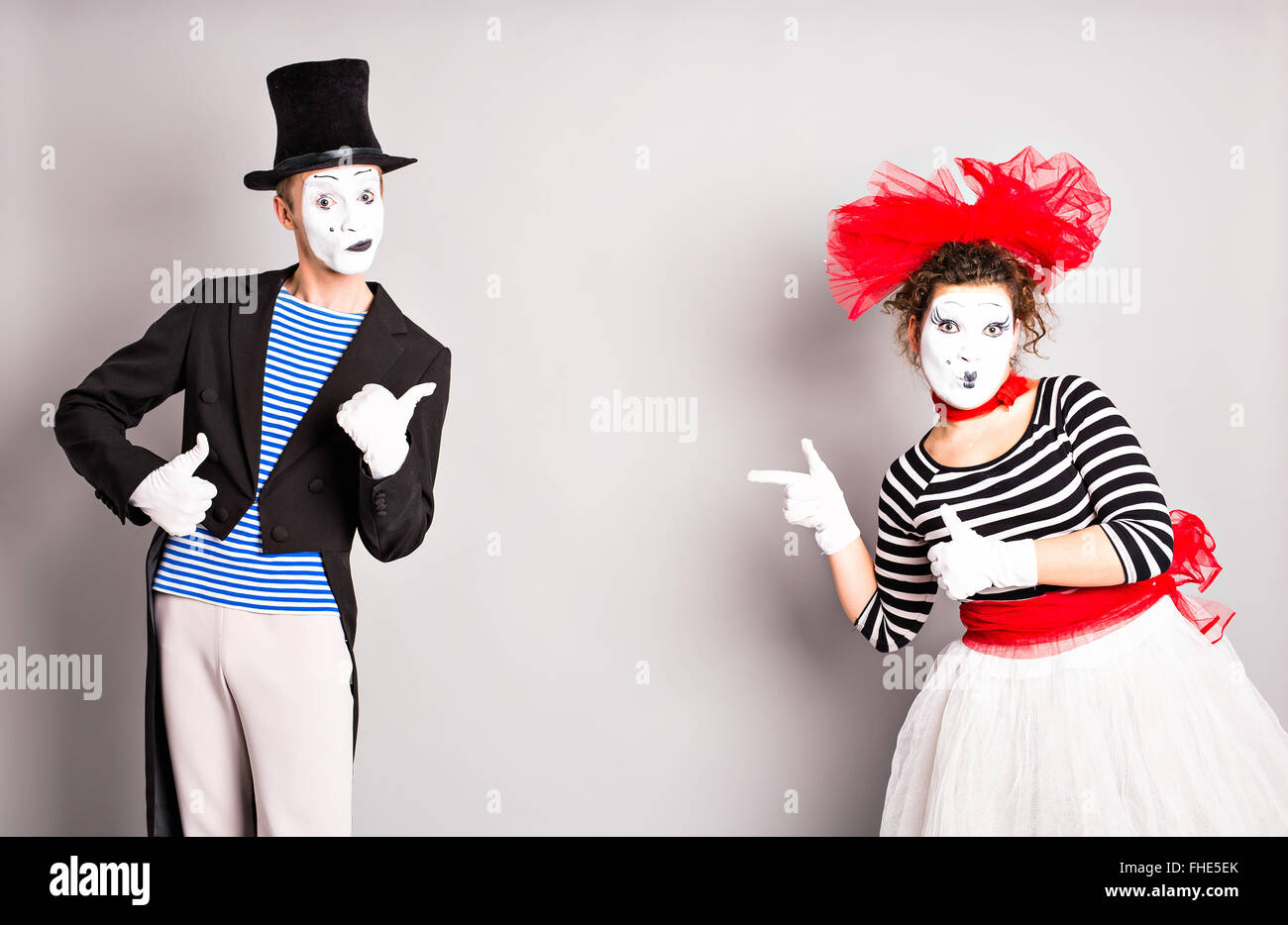 Your text here. Colorful studio portrait of mimes with gray background ...