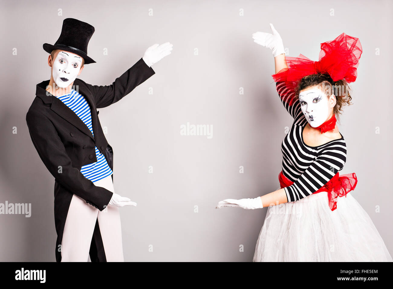 Your text here. Colorful studio portrait of mimes with gray background ...