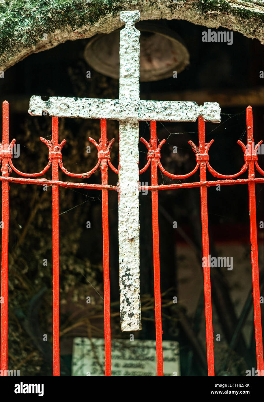 Religious White Cross on red metal gate Stock Photo - Alamy
