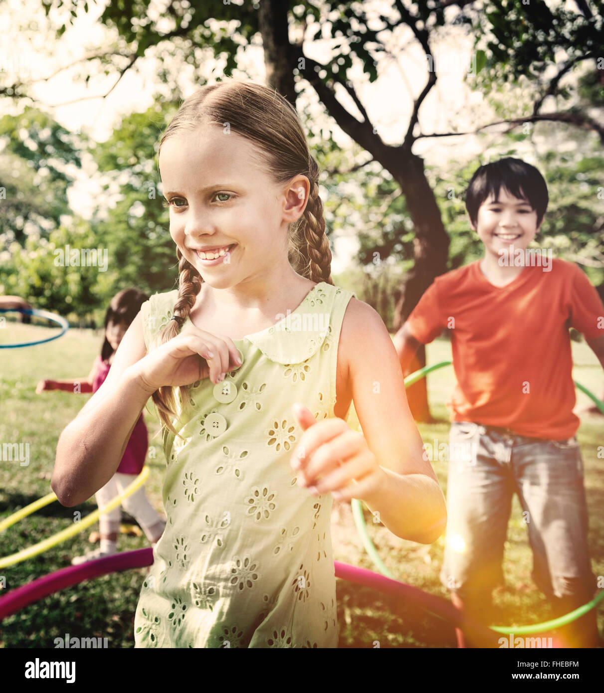 Hula hoop game children hi-res stock photography and images - Alamy