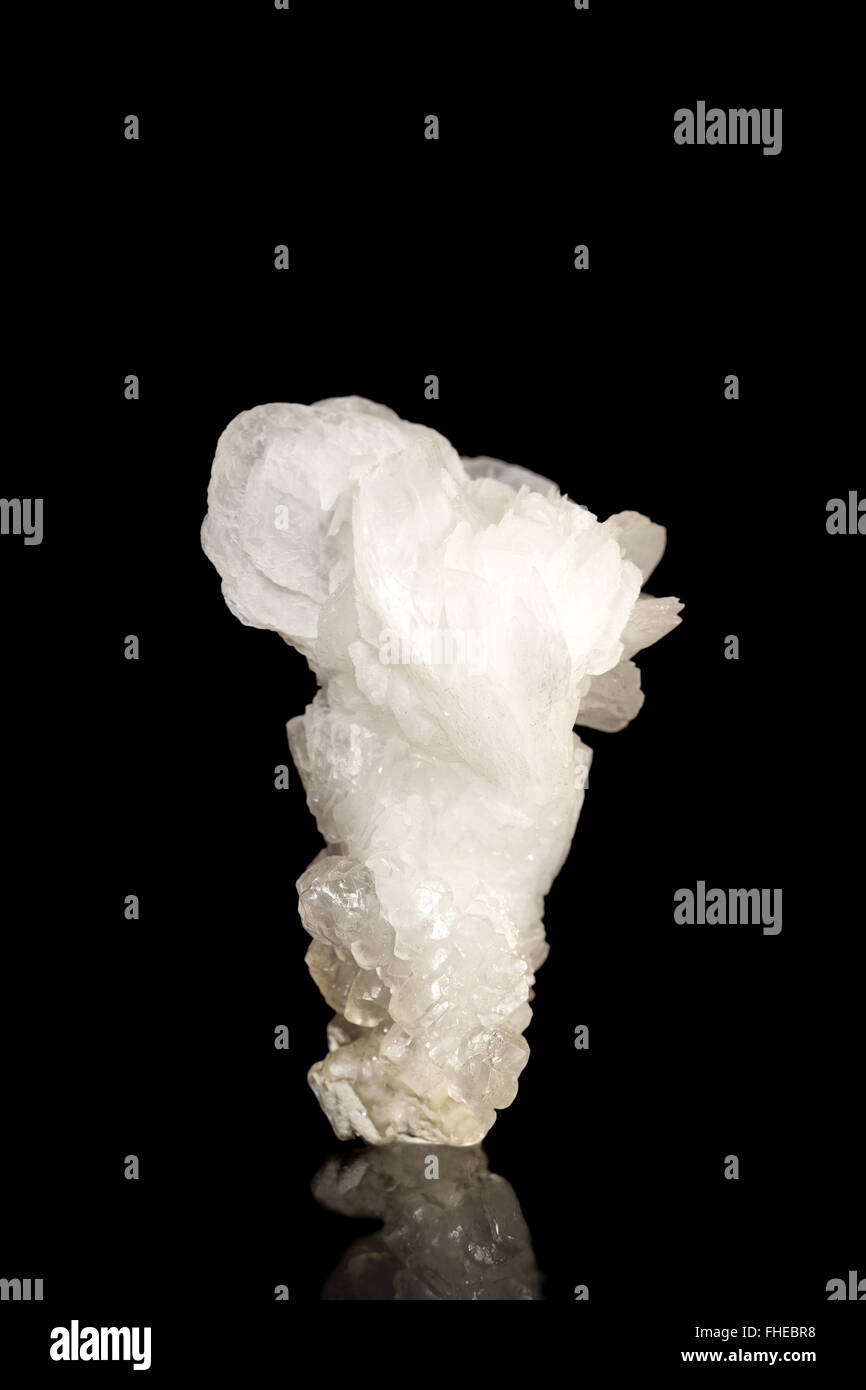 white barite mineral stone, black background with reflection Stock ...