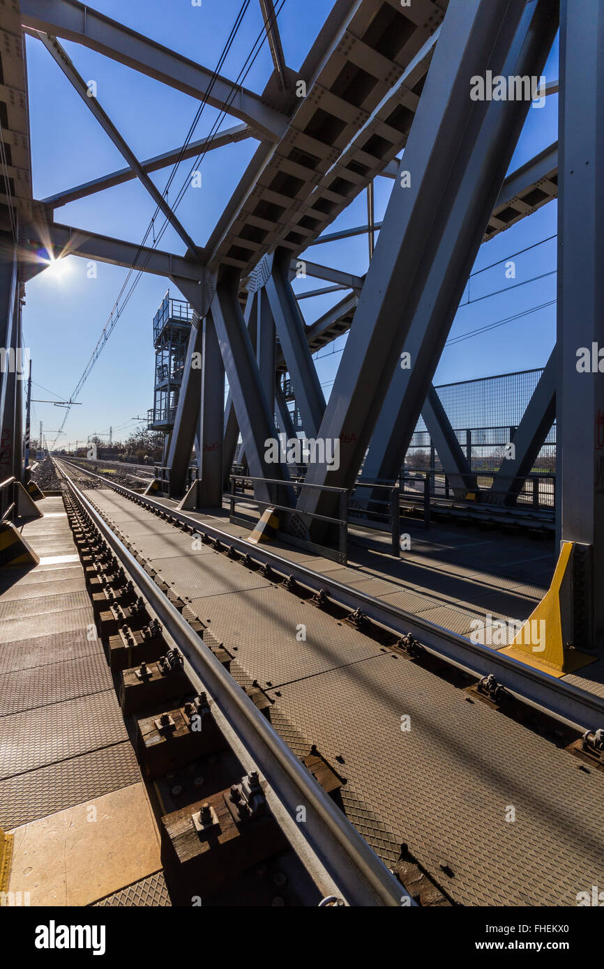 Modern railway steel bridge over highway Stock Photo - Alamy