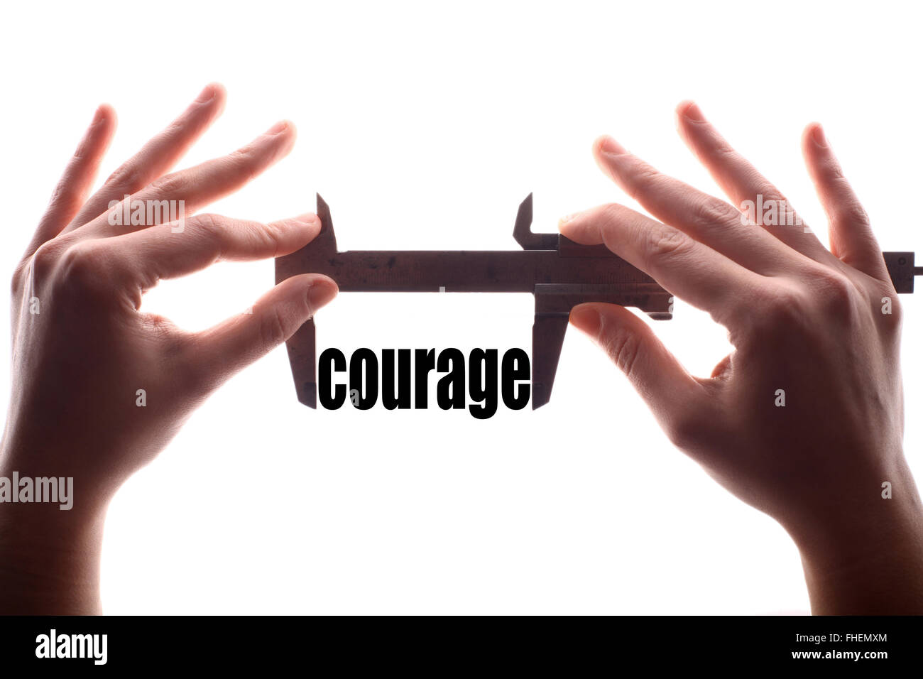 Color horizontal shot of two hands holding a caliper and measuring the ...