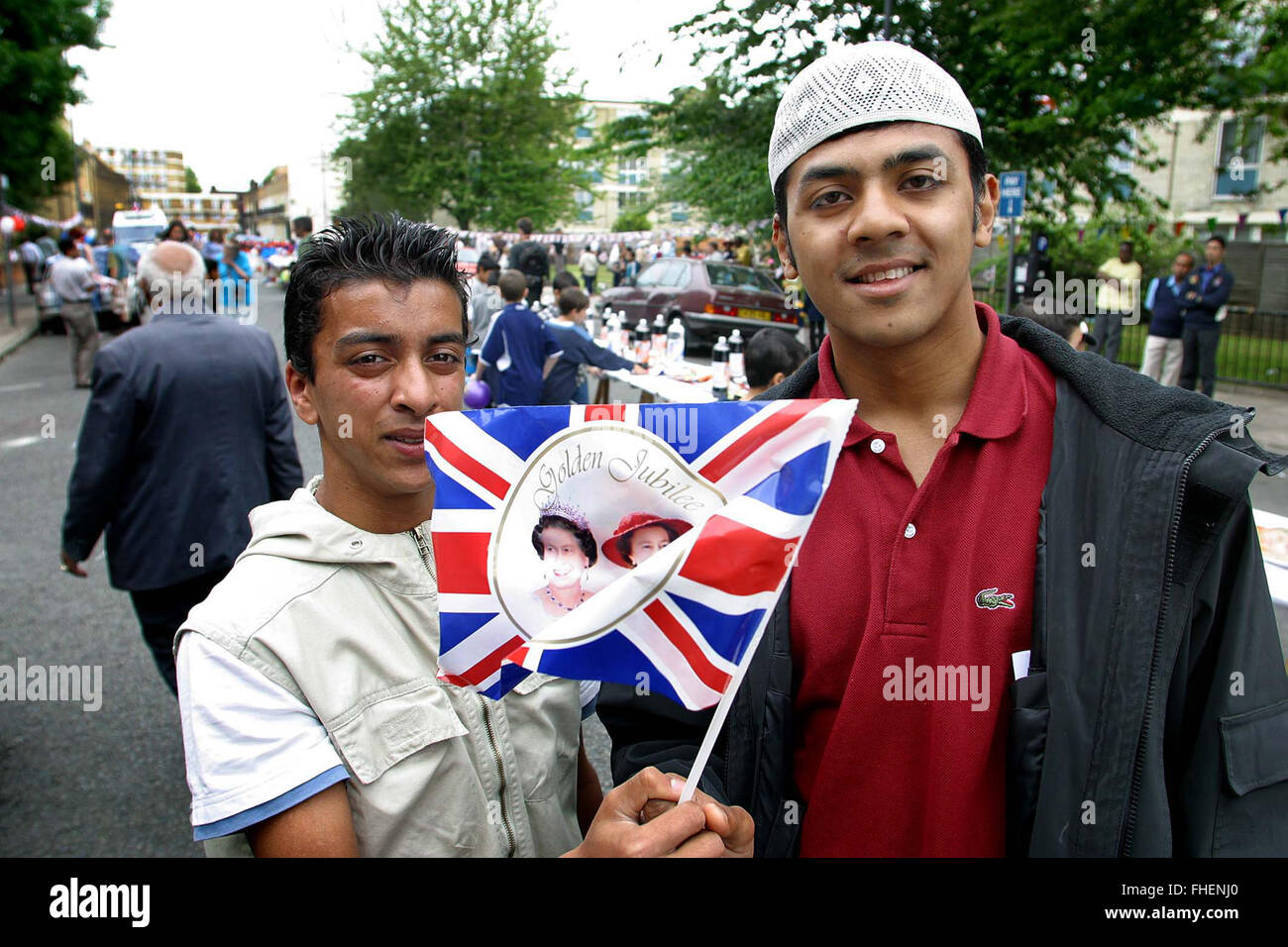 Two British Asians in Jubilee Street in Stepney Green, east London at a ...